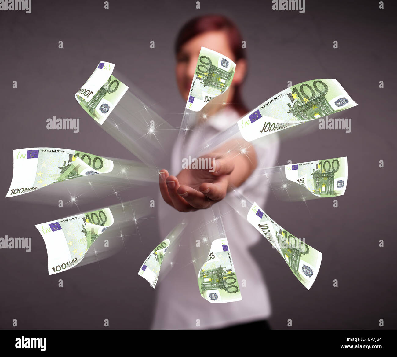 Pretty woman standing and throwing money Stock Photo - Alamy