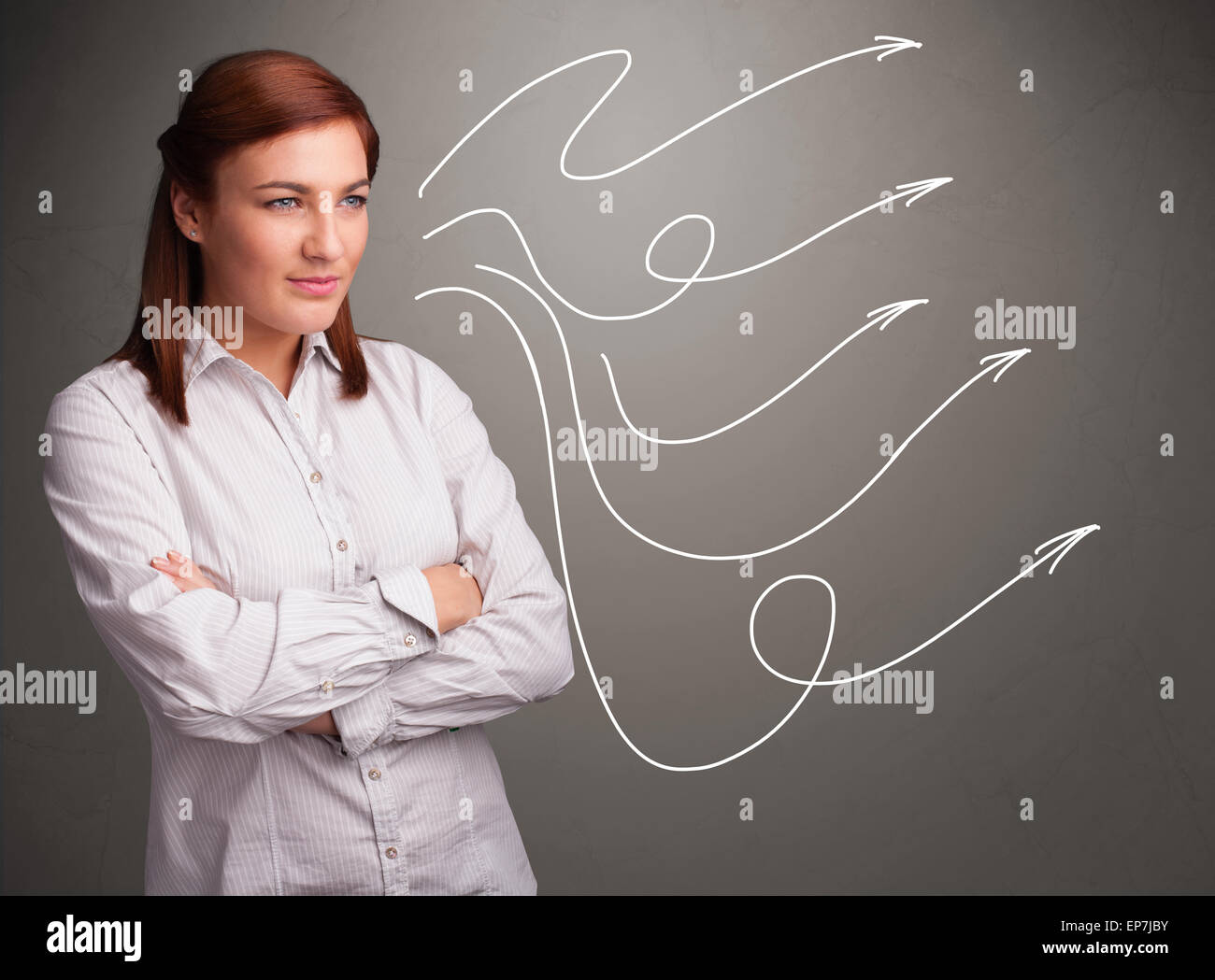 Attractive teenager looking at multiple curly arrows Stock Photo - Alamy