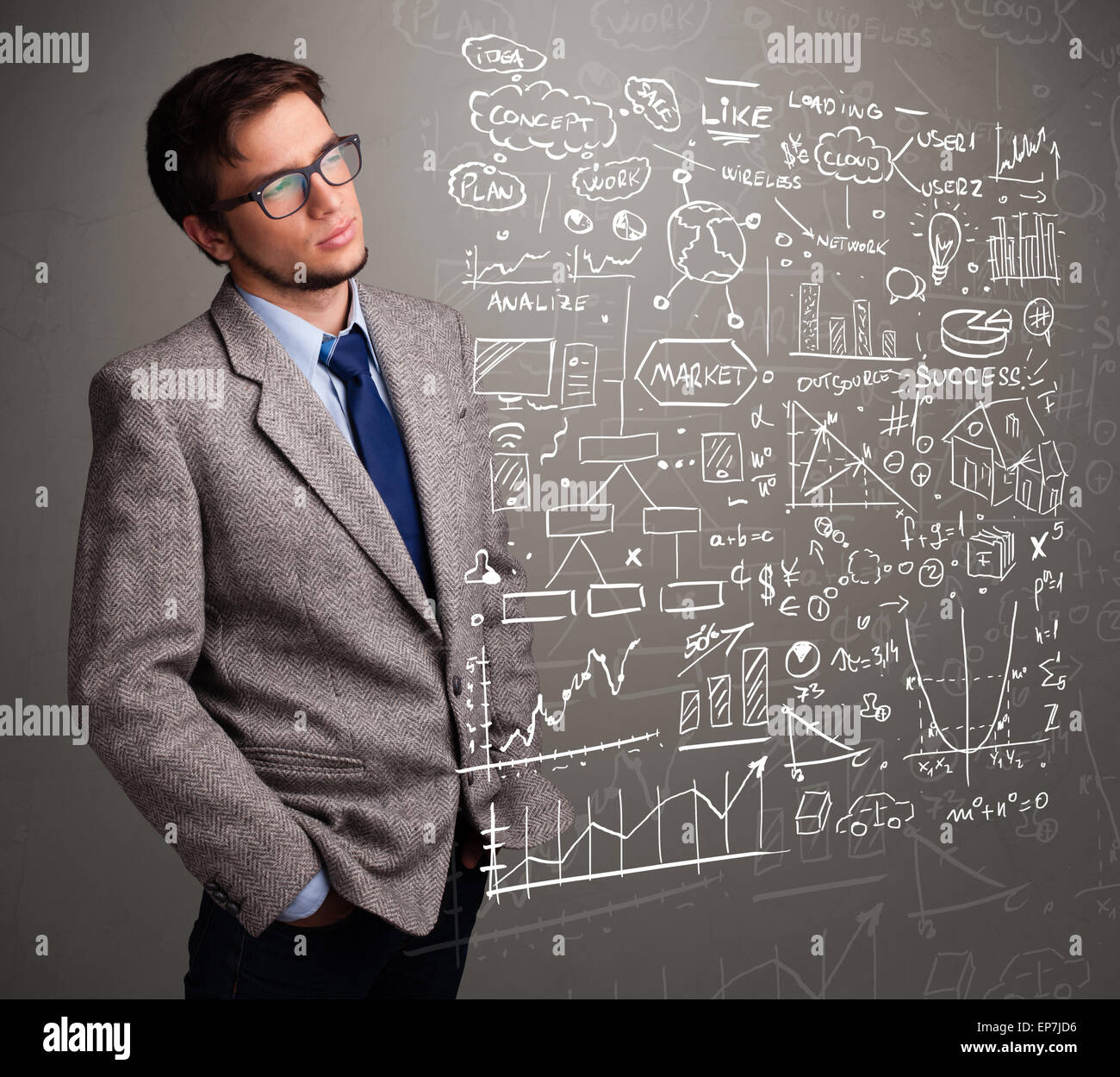Attractive man looking at stock market graphs and symbols Stock Photo ...
