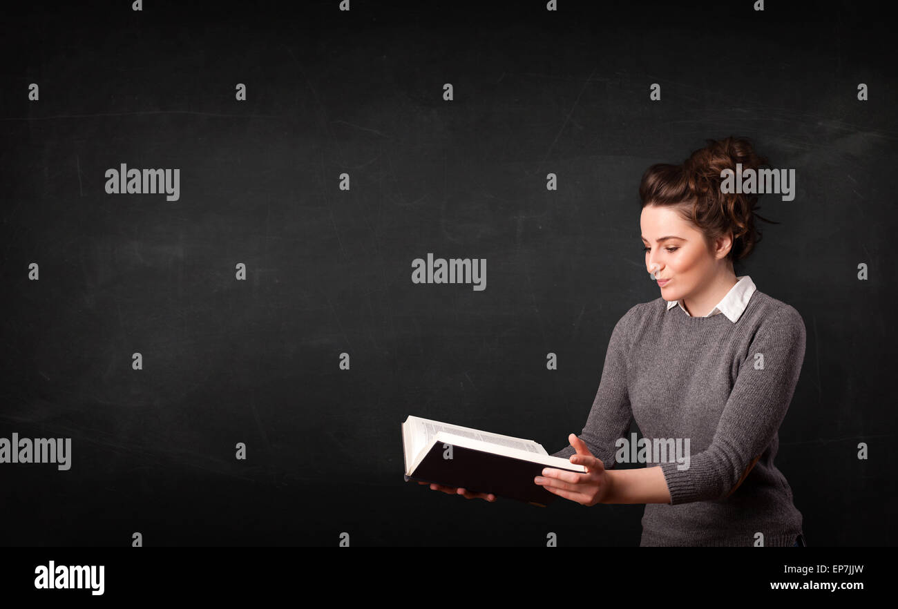 Young lady reading a book Stock Photo - Alamy