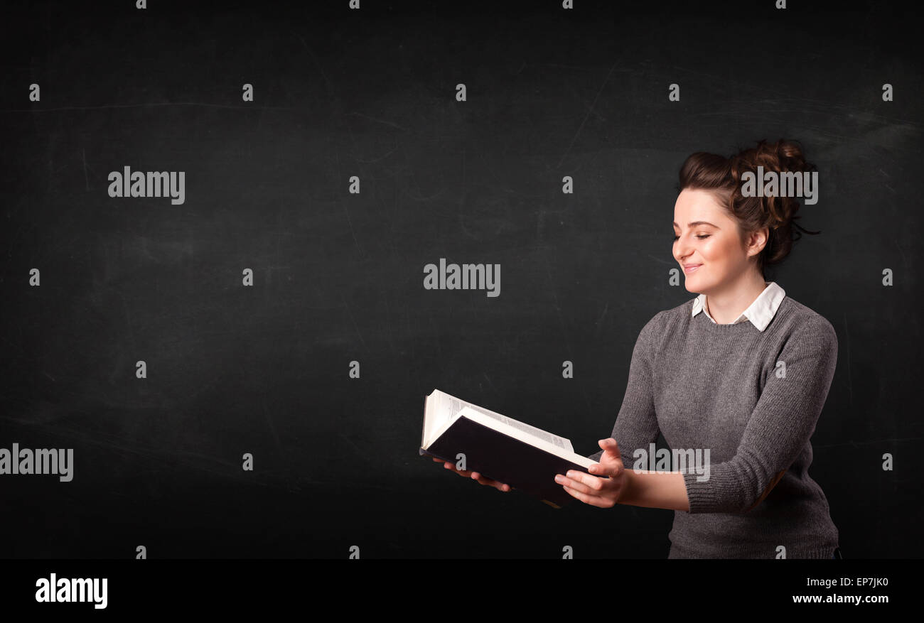 Young lady reading a book Stock Photo - Alamy