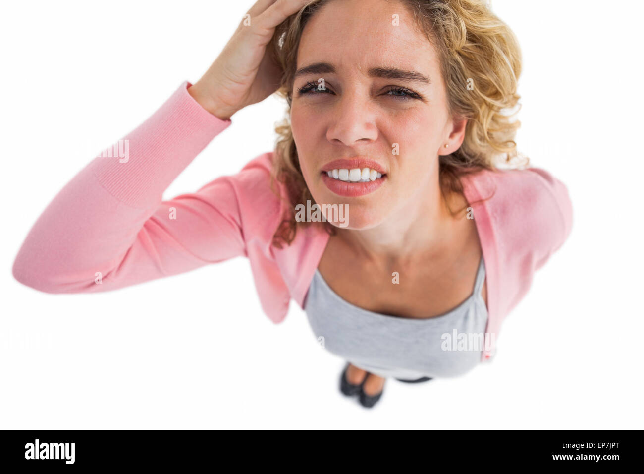 Overhead of attractive woman touching her head Stock Photo - Alamy
