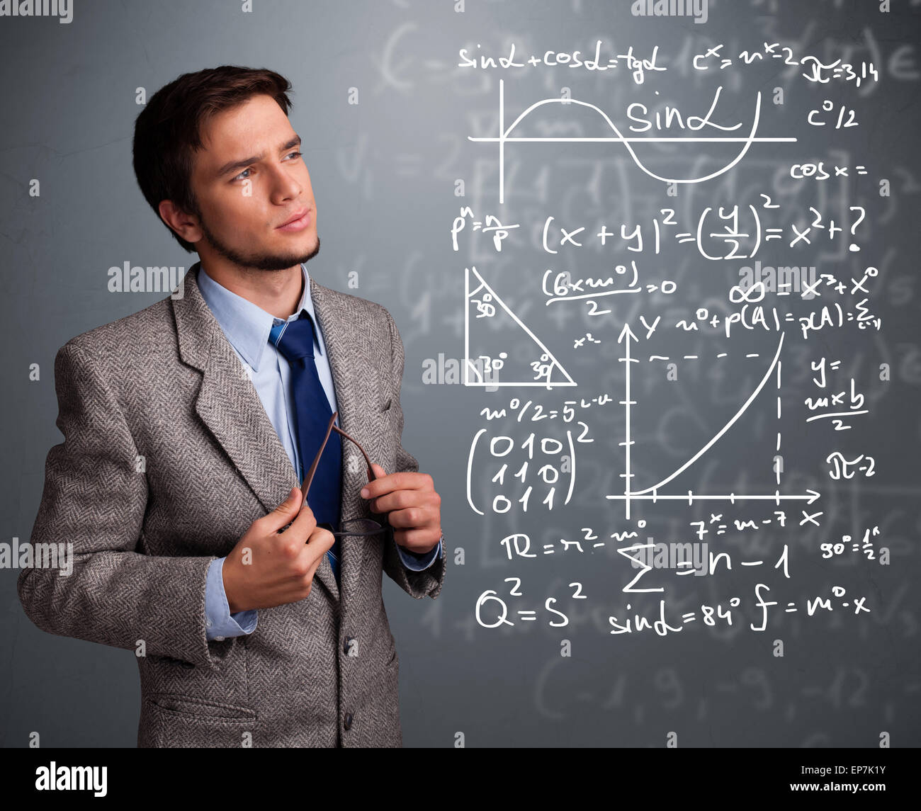 Handsome school boy thinking about complex mathematical signs Stock ...