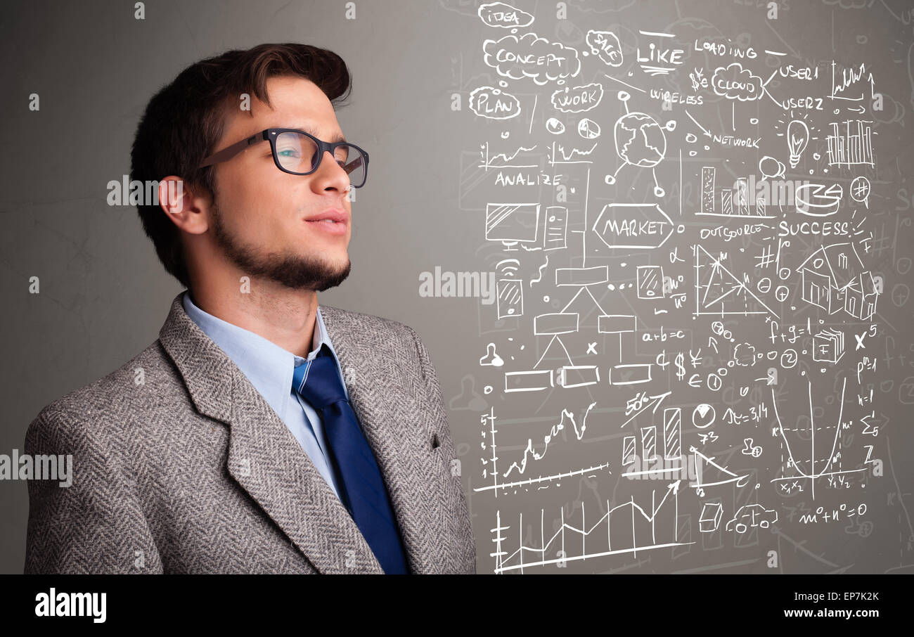 Attractive man looking at stock market graphs and symbols Stock Photo ...