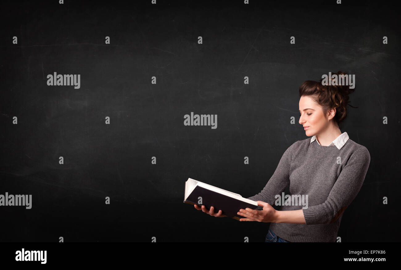 Young lady reading a book Stock Photo - Alamy