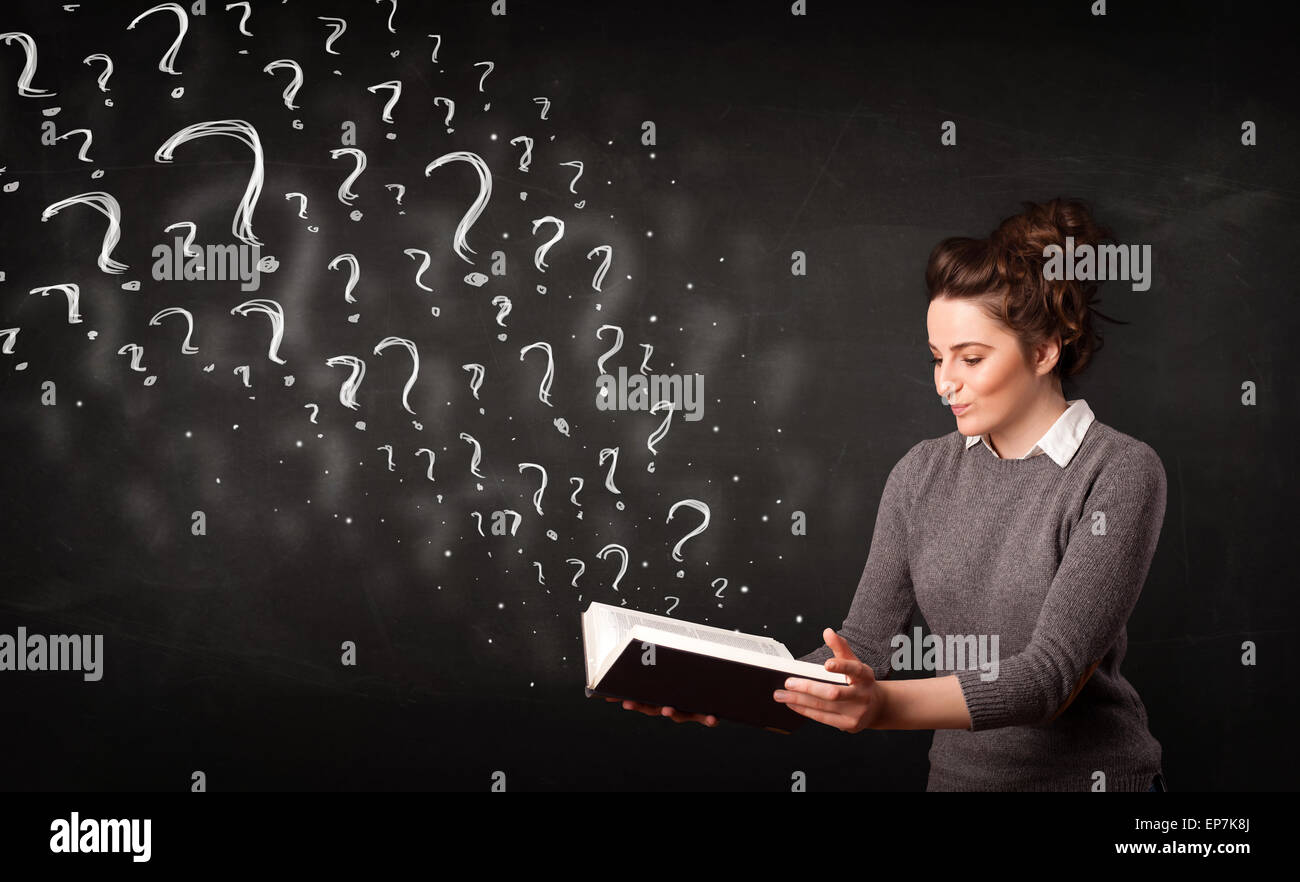 Pretty woman reading a book with question marks coming out from it ...