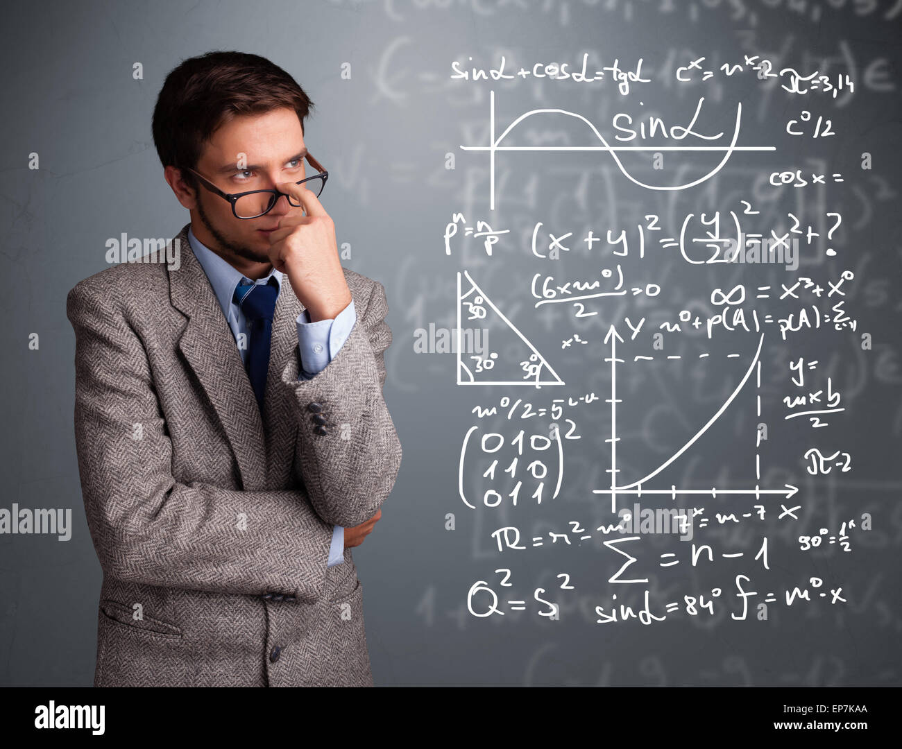 Handsome school boy thinking about complex mathematical signs Stock ...