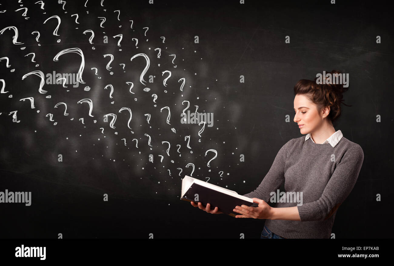 Pretty woman reading a book with question marks coming out from it ...
