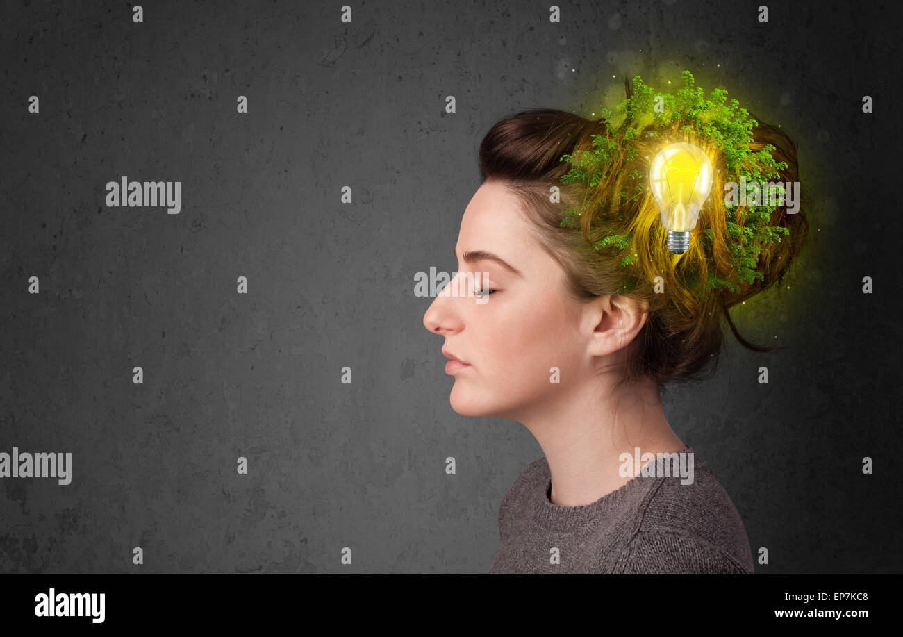 Young mind thinking of green eco energy with lightbulb Stock Photo - Alamy