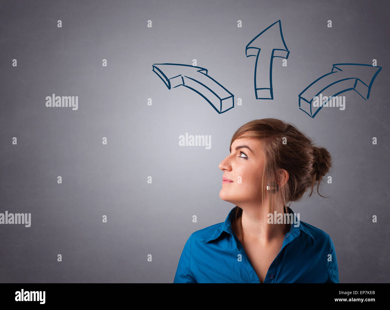 Pretty lady thinking with arrows overhead Stock Photo - Alamy