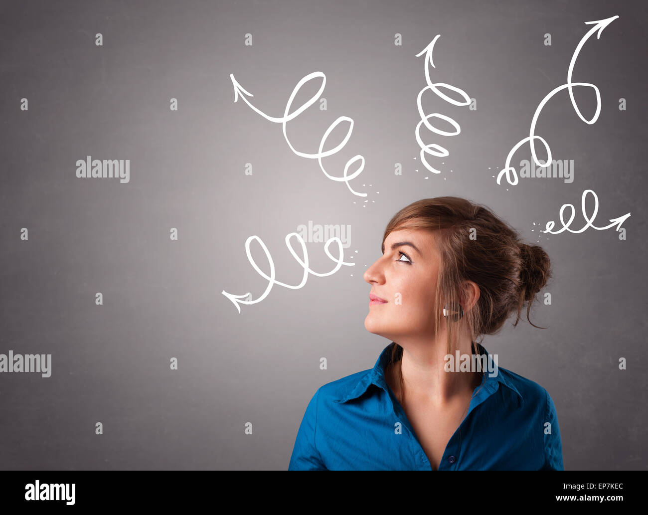 Young woman thinking with arrows overhead Stock Photo - Alamy