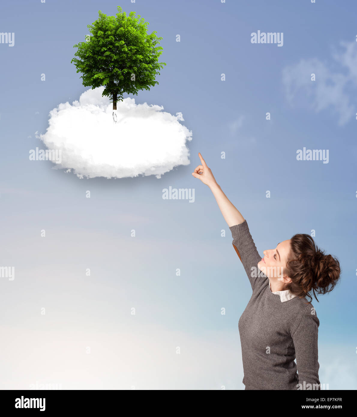 Young girl pointing at a green tree on top of a white cloud Stock Photo ...