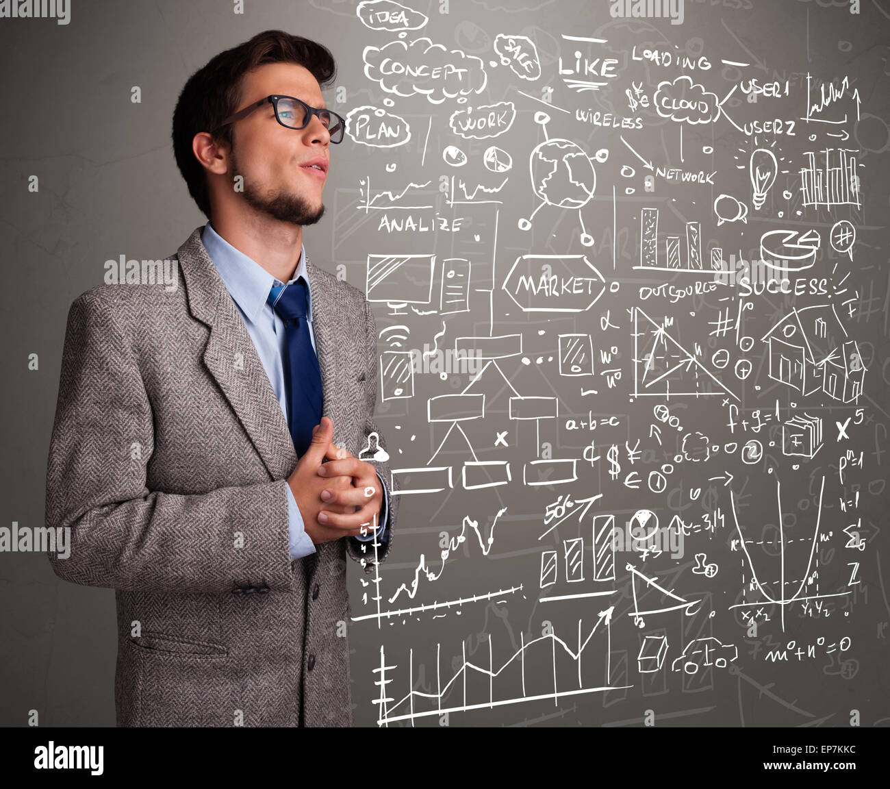 Attractive man looking at stock market graphs and symbols Stock Photo ...