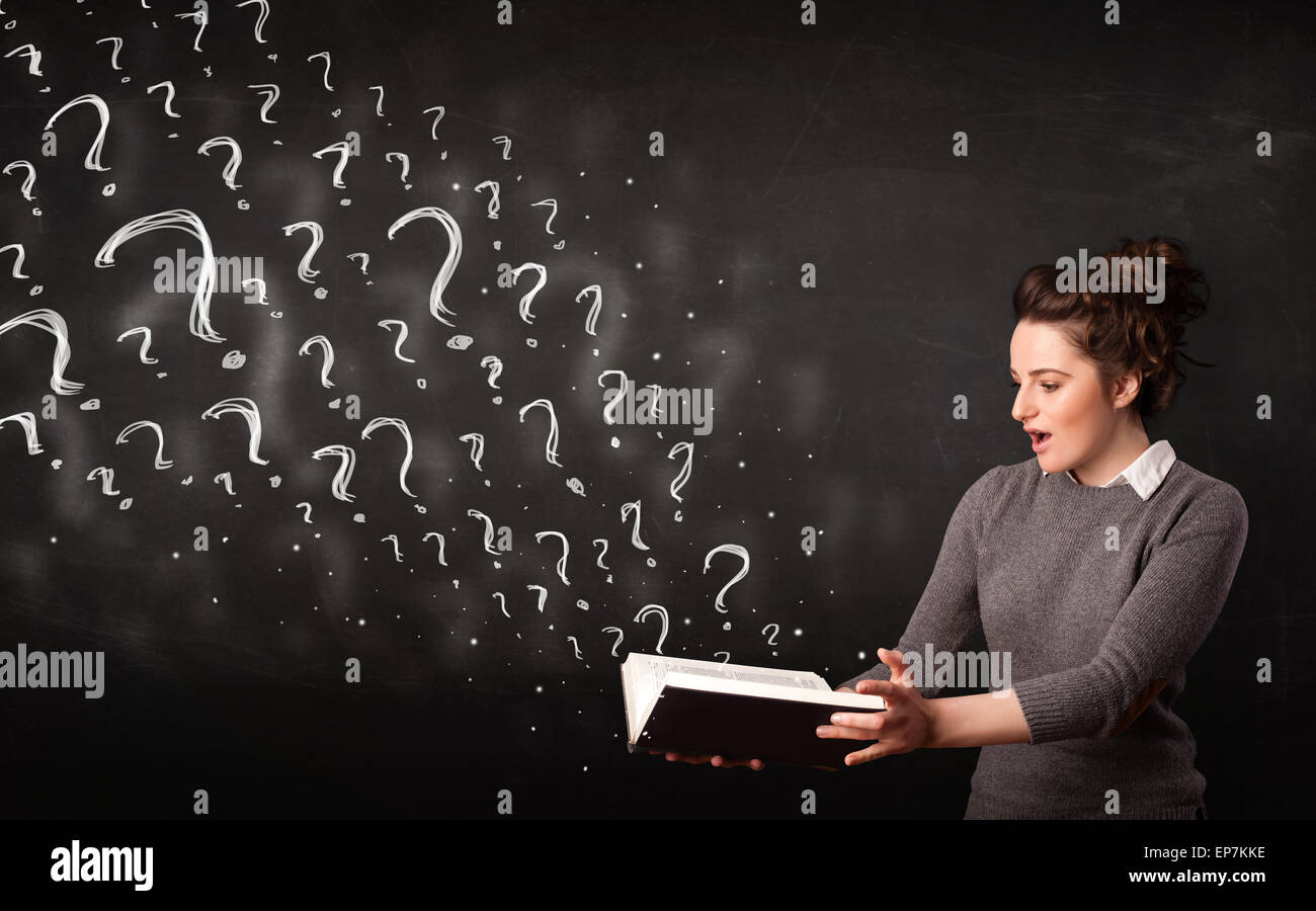 Pretty woman reading a book with question marks coming out from it ...