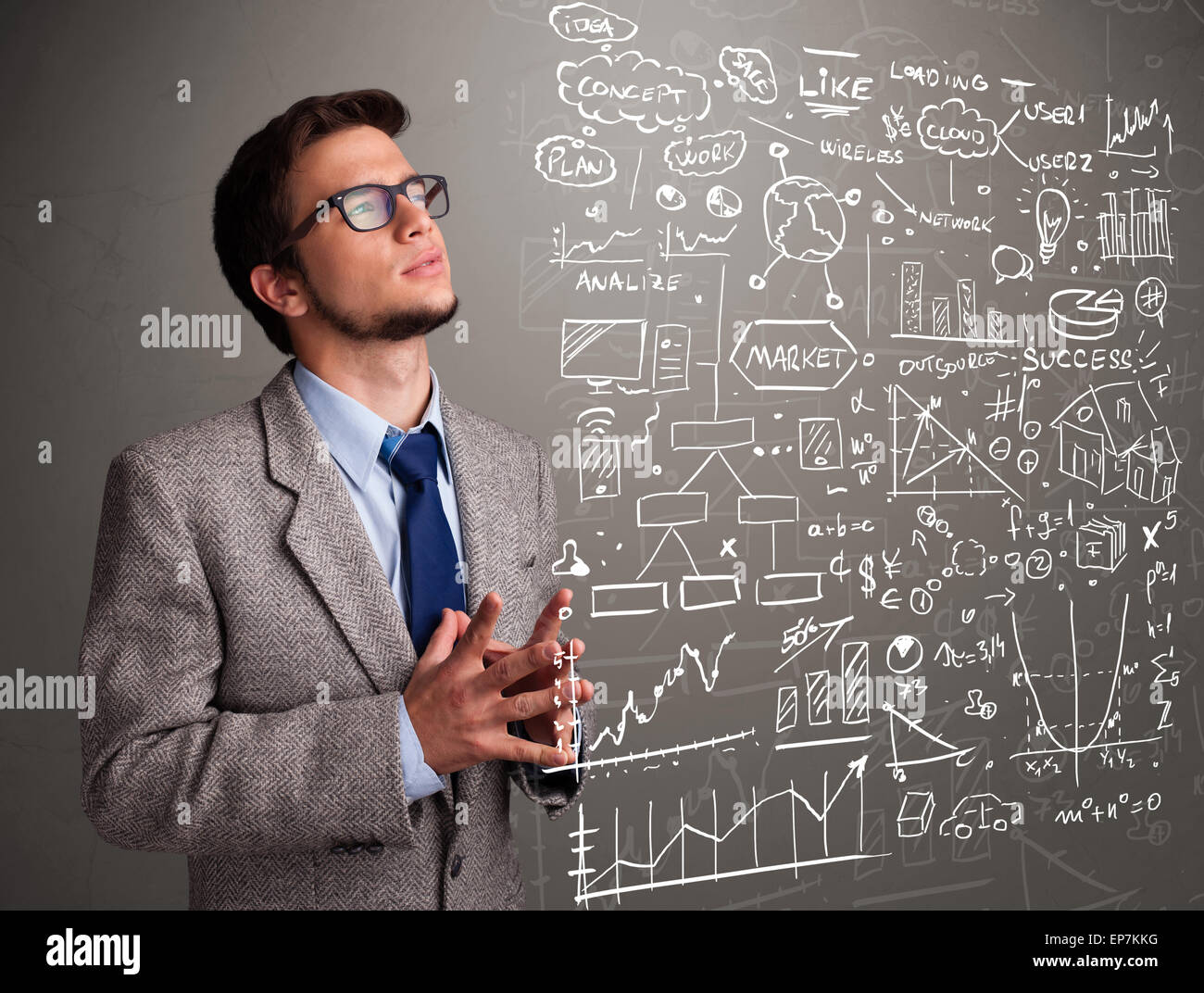 Attractive man looking at stock market graphs and symbols Stock Photo ...