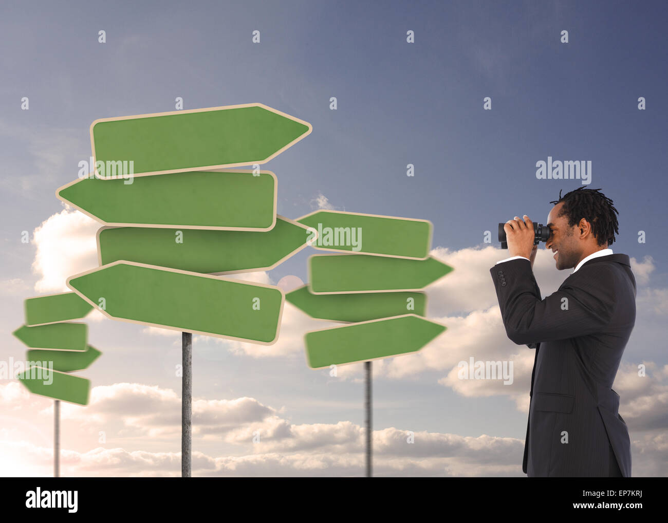 Businessman looking at empty signposts with binoculars Stock Photo - Alamy