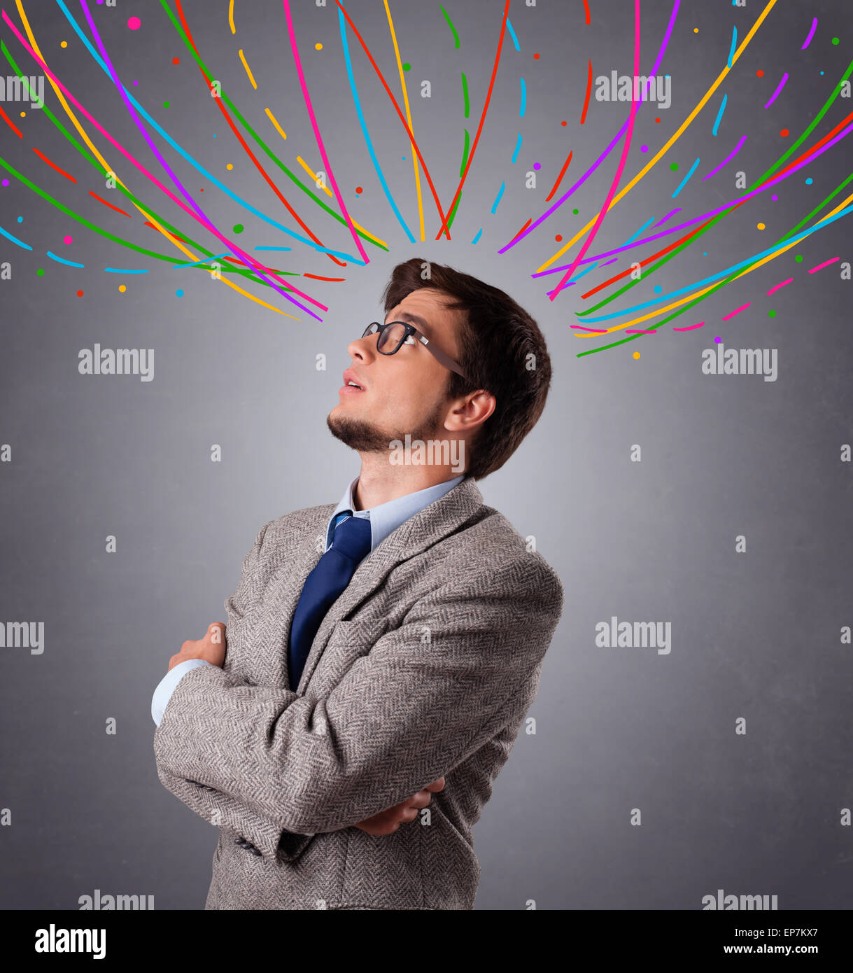 Young man thinking wiht colorful abstract lines overhead Stock Photo ...