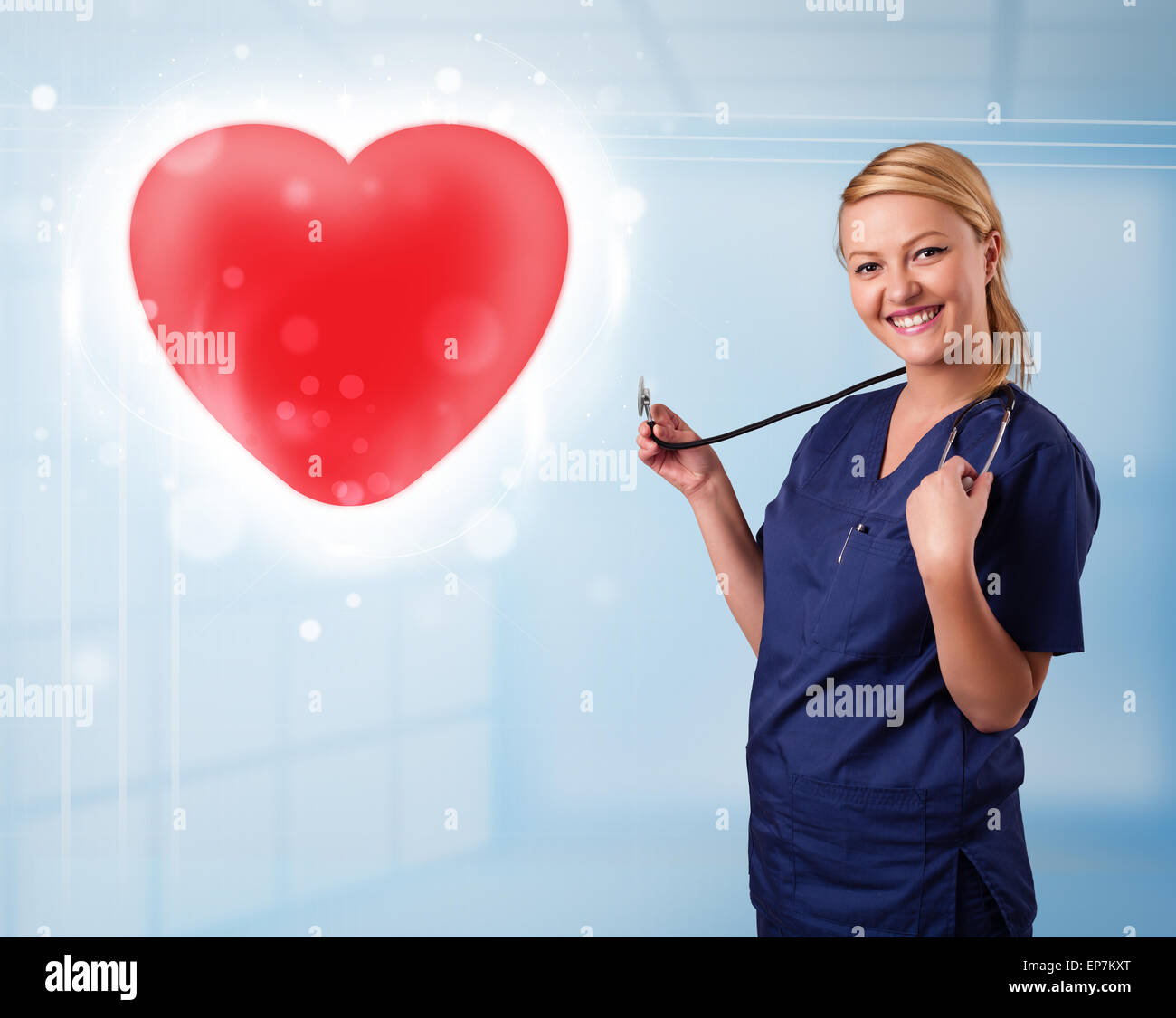 Young nurse healing a red heart Stock Photo - Alamy