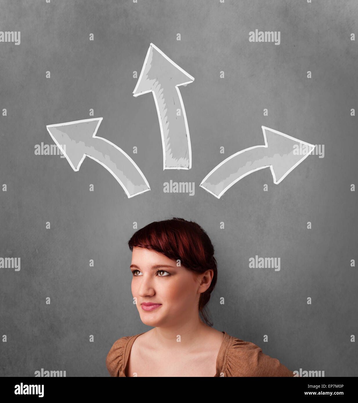 Young woman thinking with arrows above her head Stock Photo - Alamy