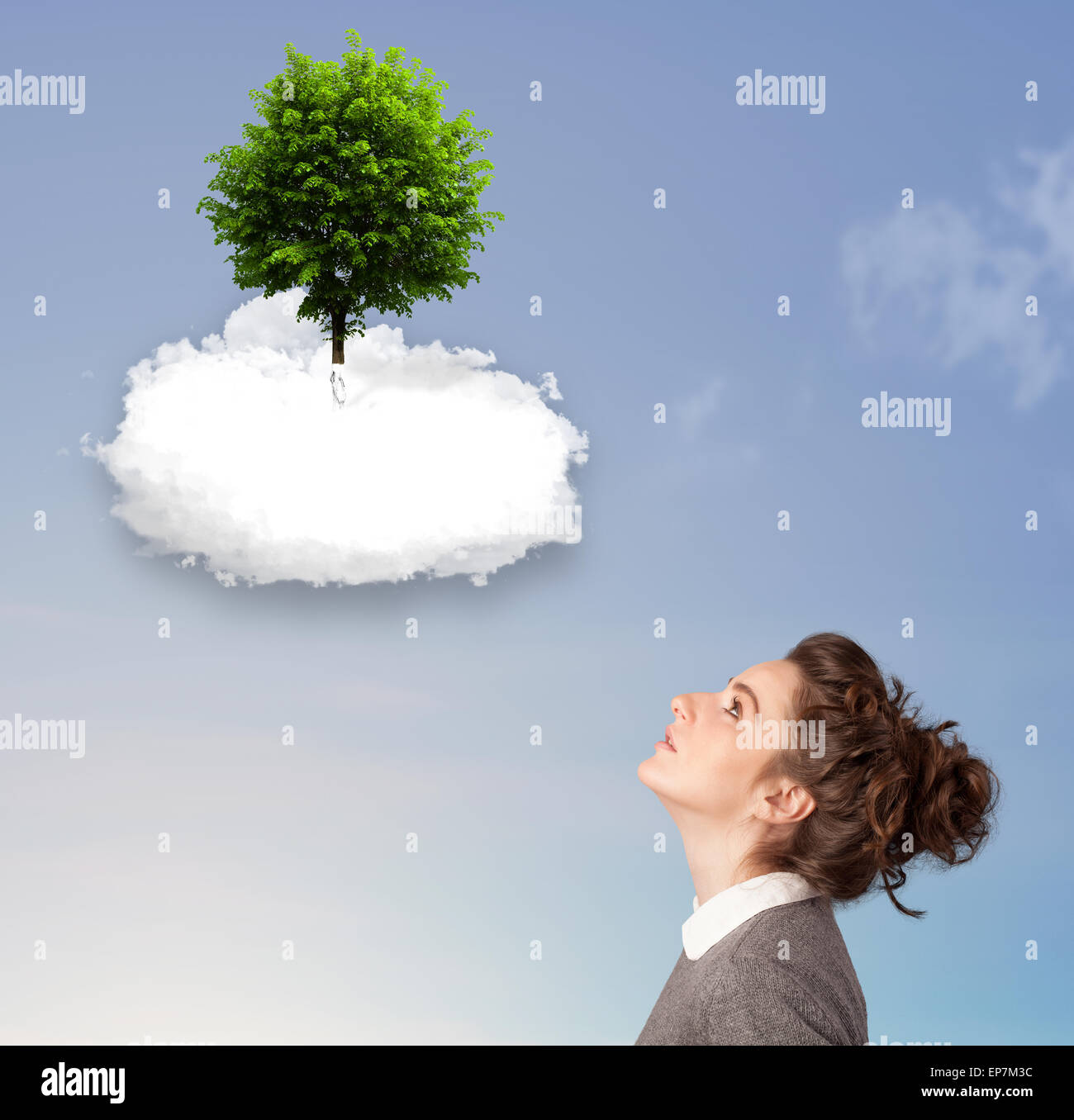Young girl pointing at a green tree on top of a white cloud Stock Photo ...