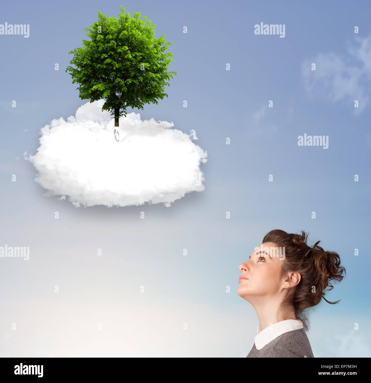Young girl pointing at a green tree on top of a white cloud Stock Photo ...