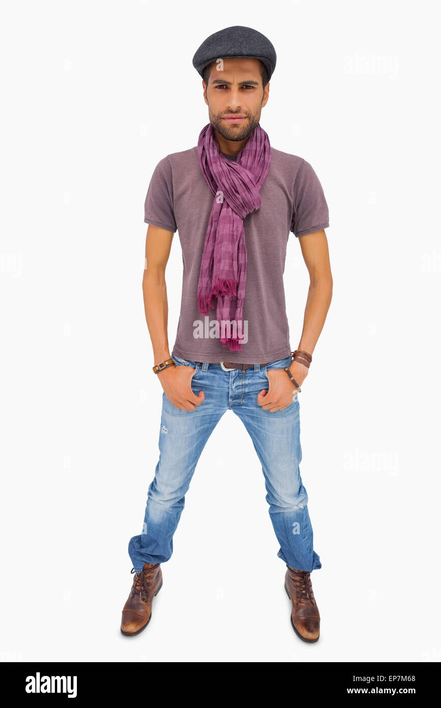 Serious man wearing peaked cap and scarf looking at camera Stock Photo ...