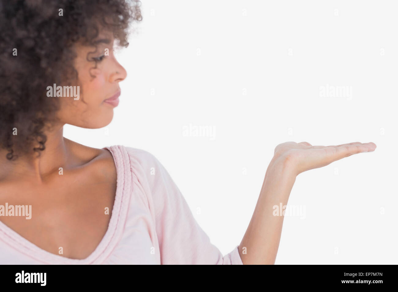 Pretty woman holding hand out in presentation Stock Photo - Alamy