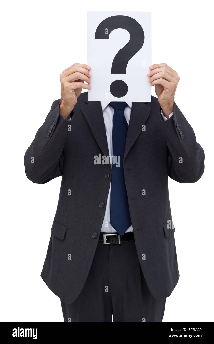 Businessman holding a question mark paper in front of his face Stock ...