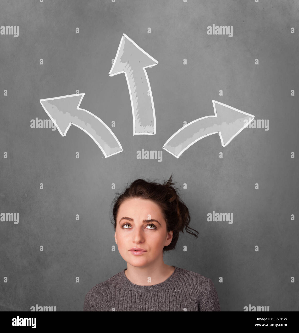Young woman thinking with arrows above her head Stock Photo - Alamy