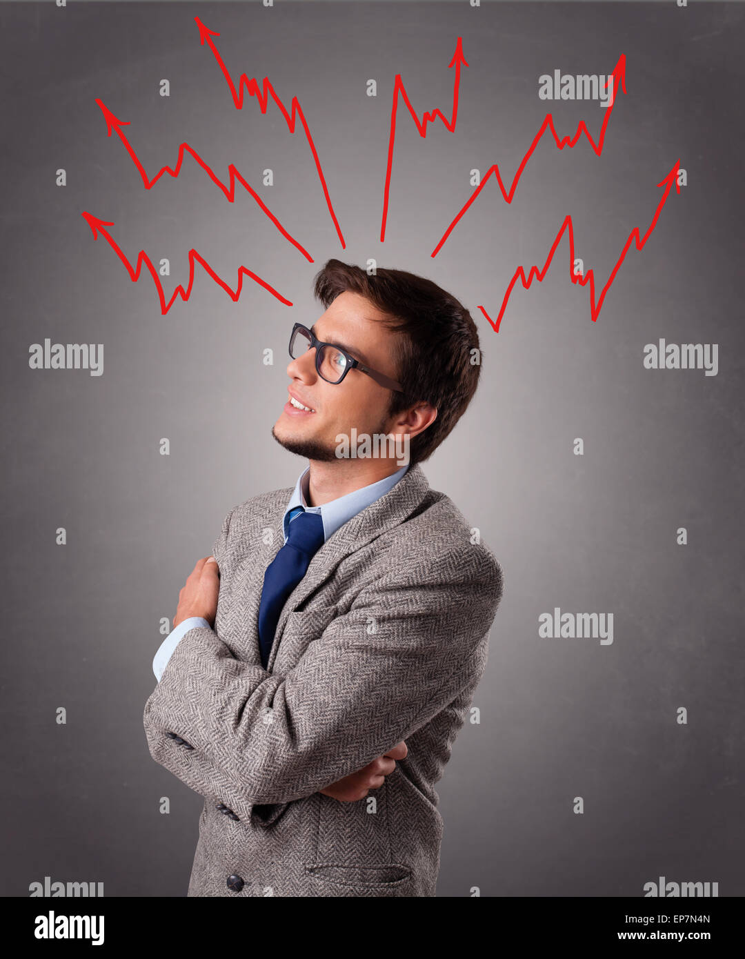 Handsome man thinking with arrows overhea Stock Photo - Alamy