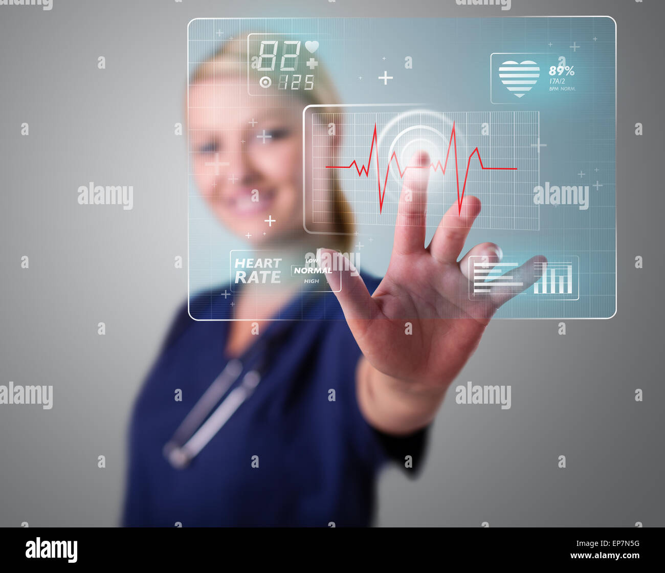 Young nurse pressing modern medical type of buttons Stock Photo - Alamy