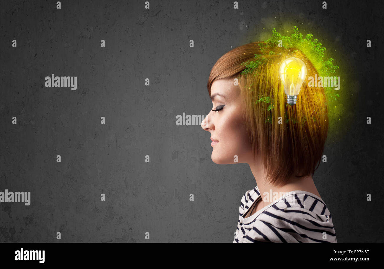 Young mind thinking of green eco energy with lightbulb Stock Photo - Alamy