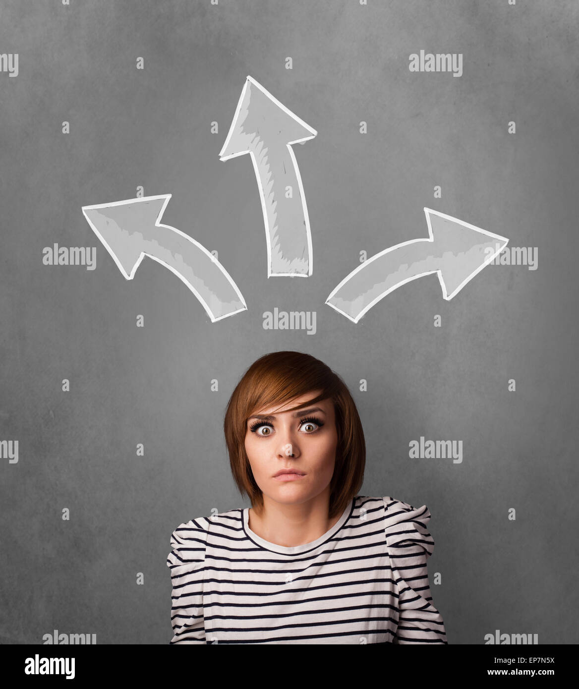Young woman thinking with arrows above her head Stock Photo - Alamy