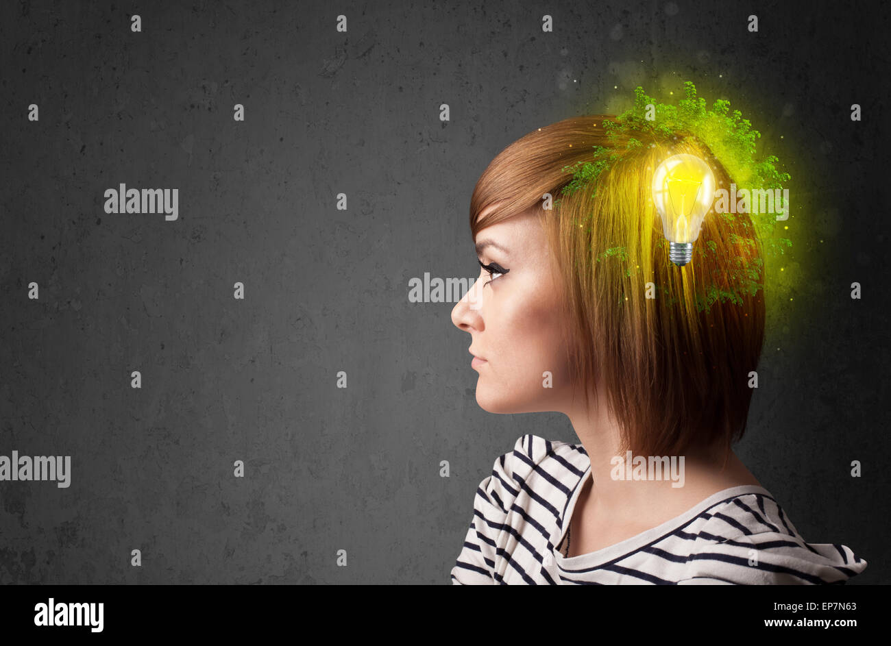 Young mind thinking of green eco energy with lightbulb Stock Photo - Alamy
