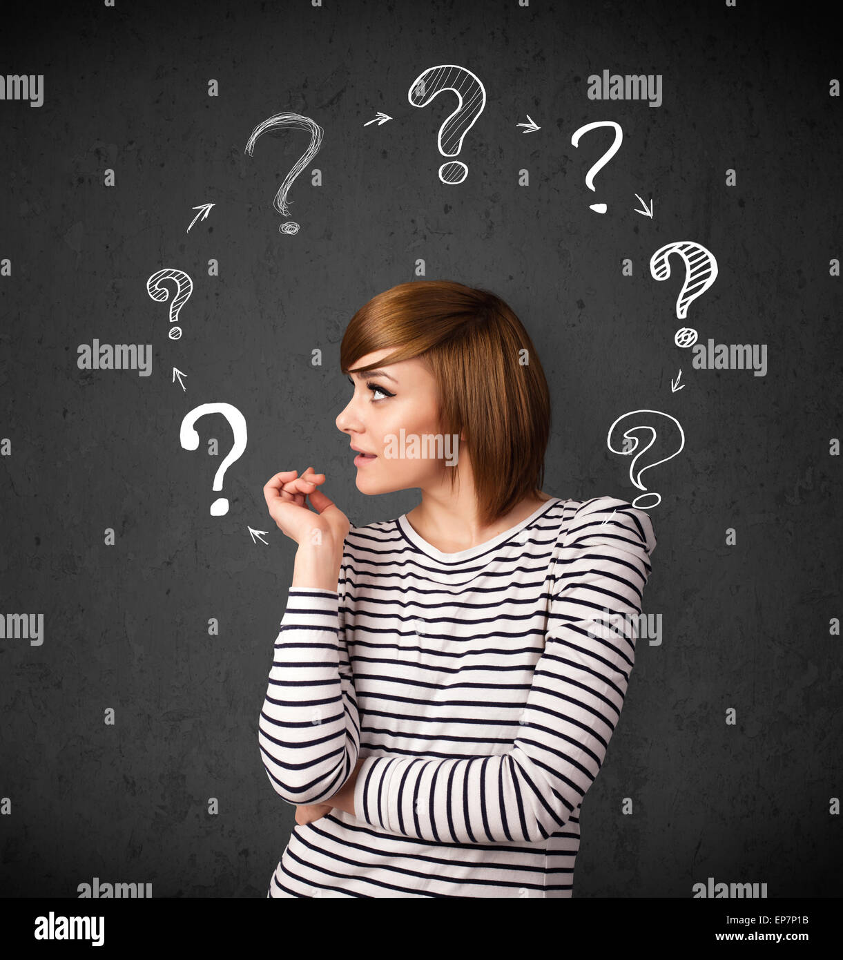 Young woman thinking with question mark circulation around her head ...