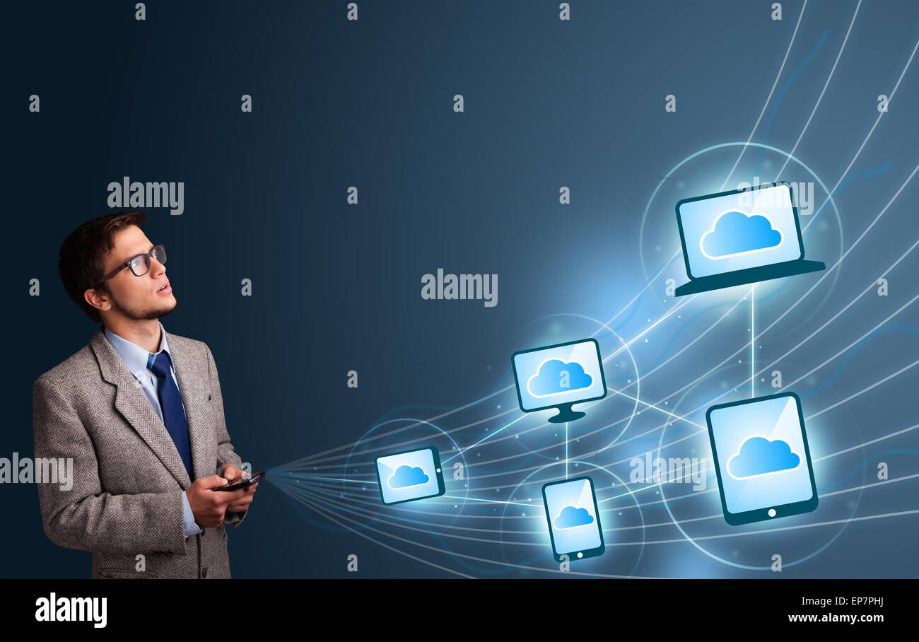 Handsome man typing on smartphone with cloud computing Stock Photo - Alamy