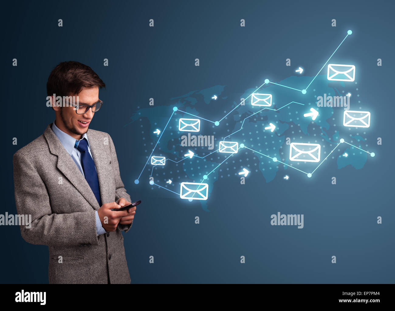 Young man holding a phone with arrows and message icons Stock Photo - Alamy