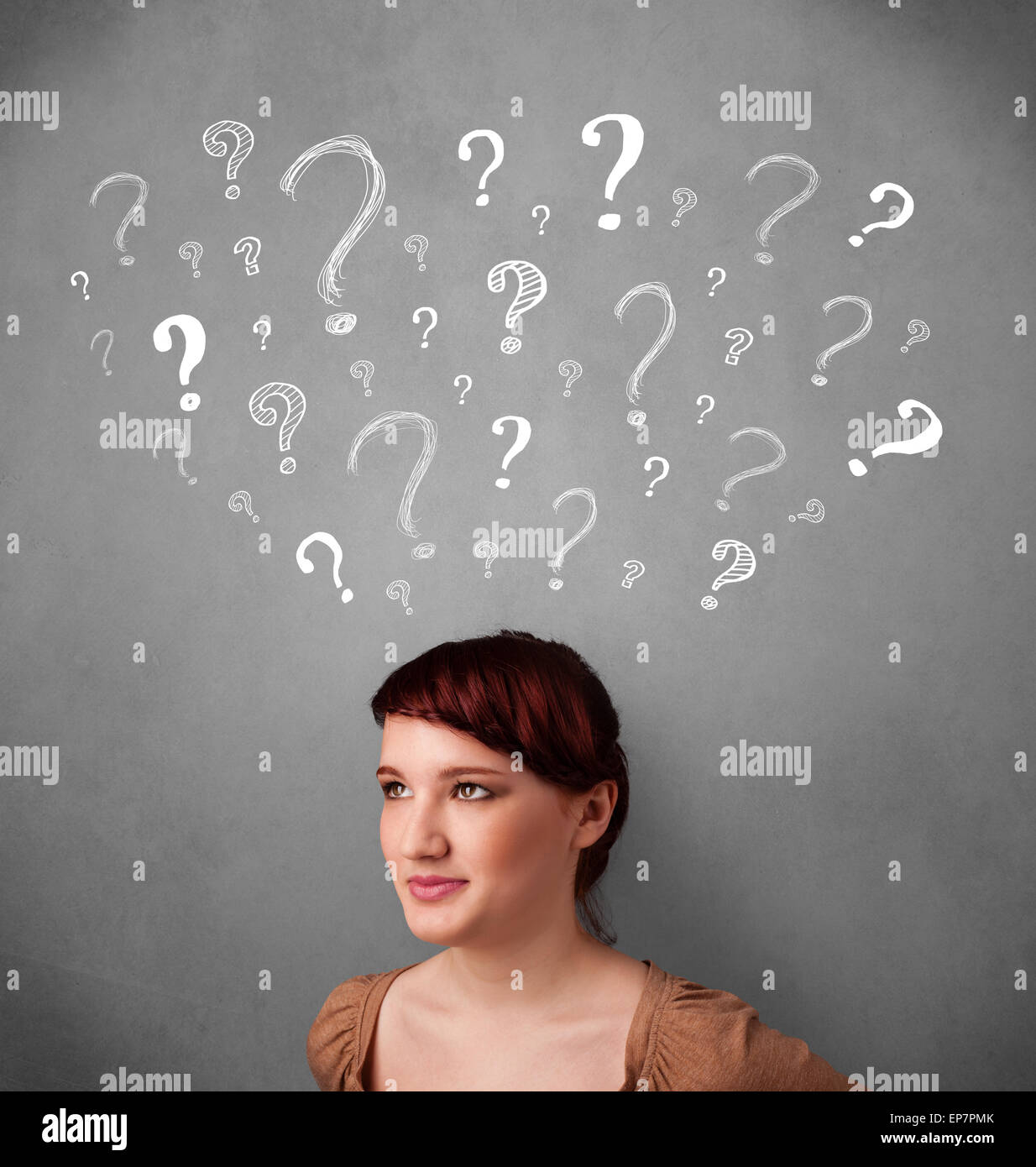 Young woman with question marks above her head Stock Photo - Alamy