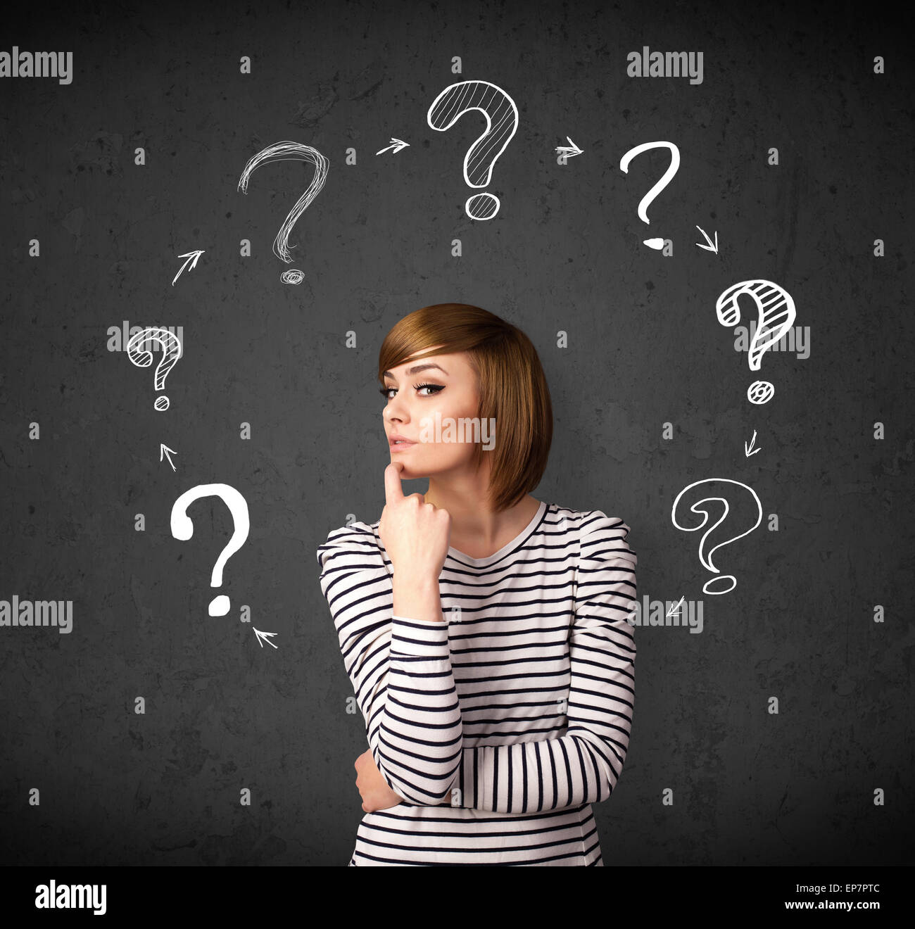 Young woman thinking with question mark circulation around her head ...