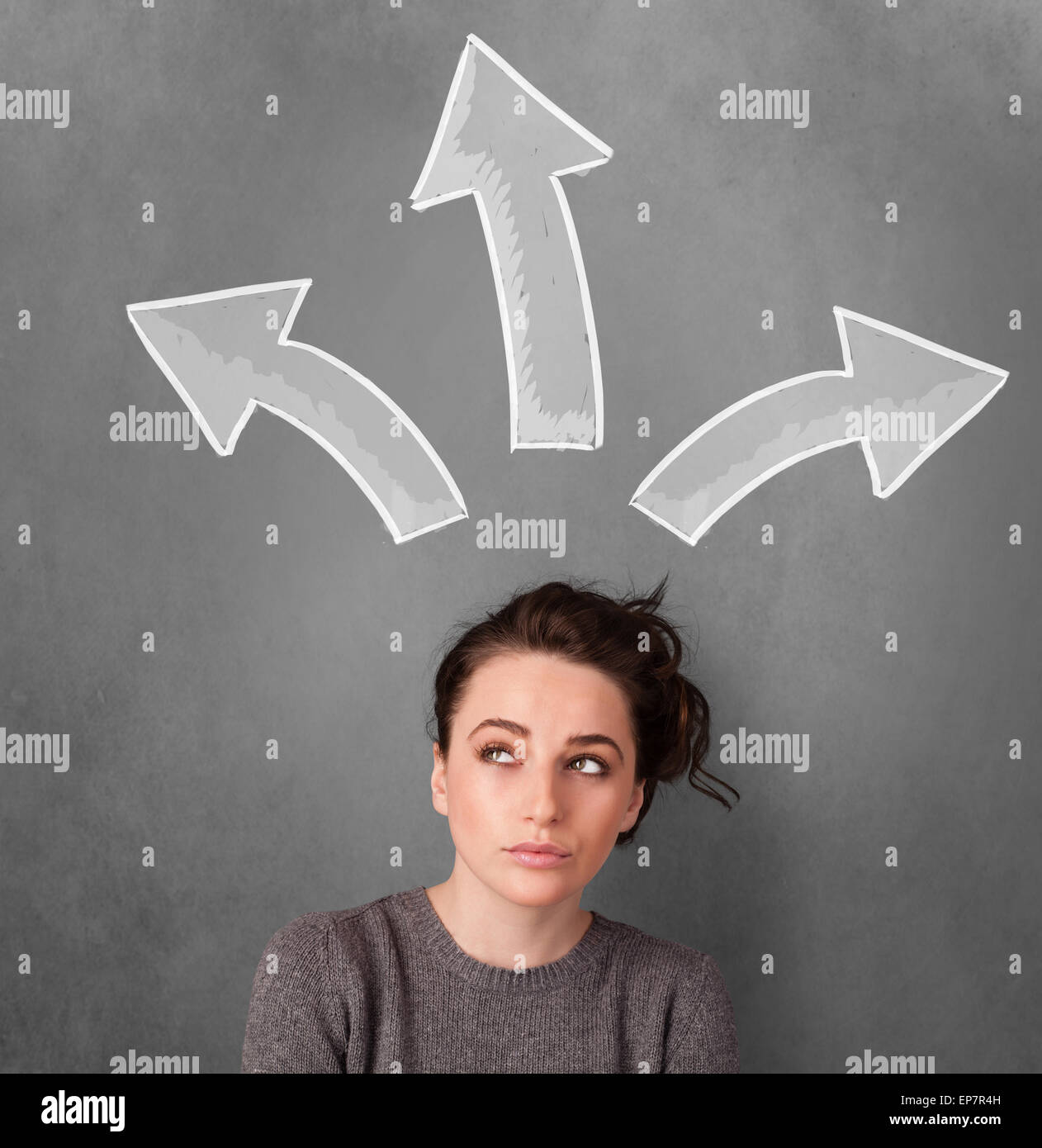 Young woman thinking with arrows above her head Stock Photo - Alamy