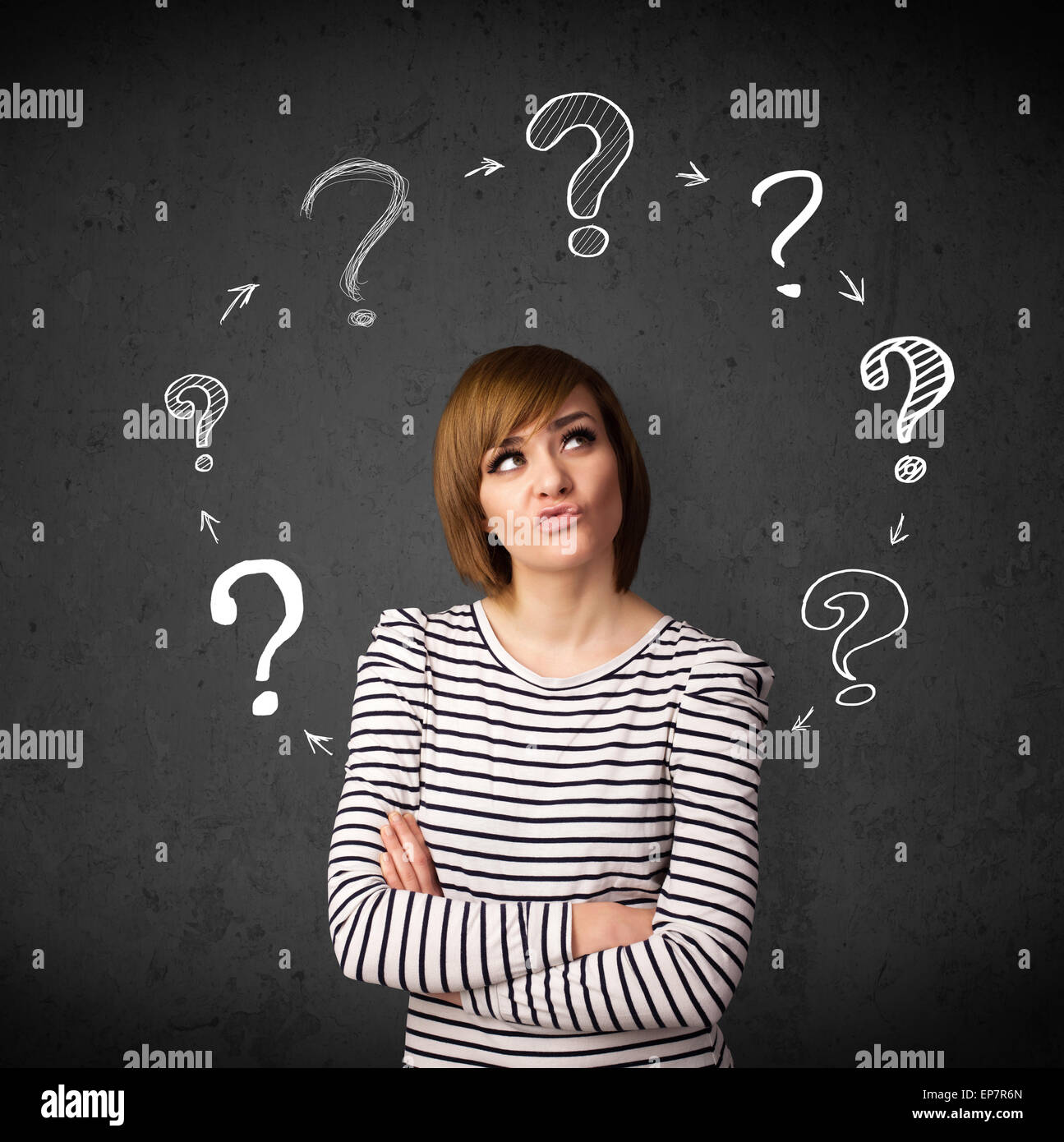 Young woman thinking with question mark circulation around her head ...