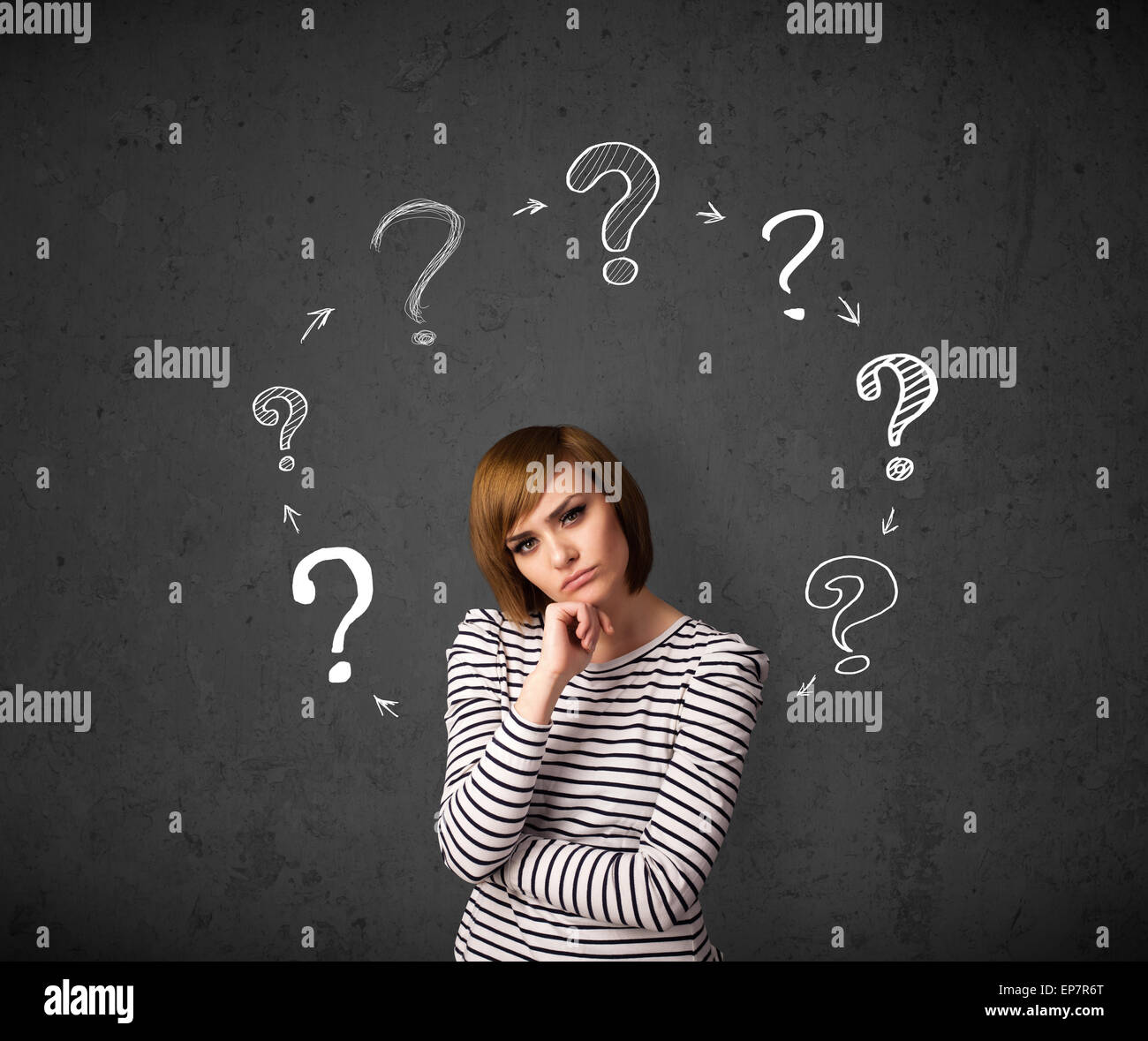 Young woman thinking with question mark circulation around her head ...