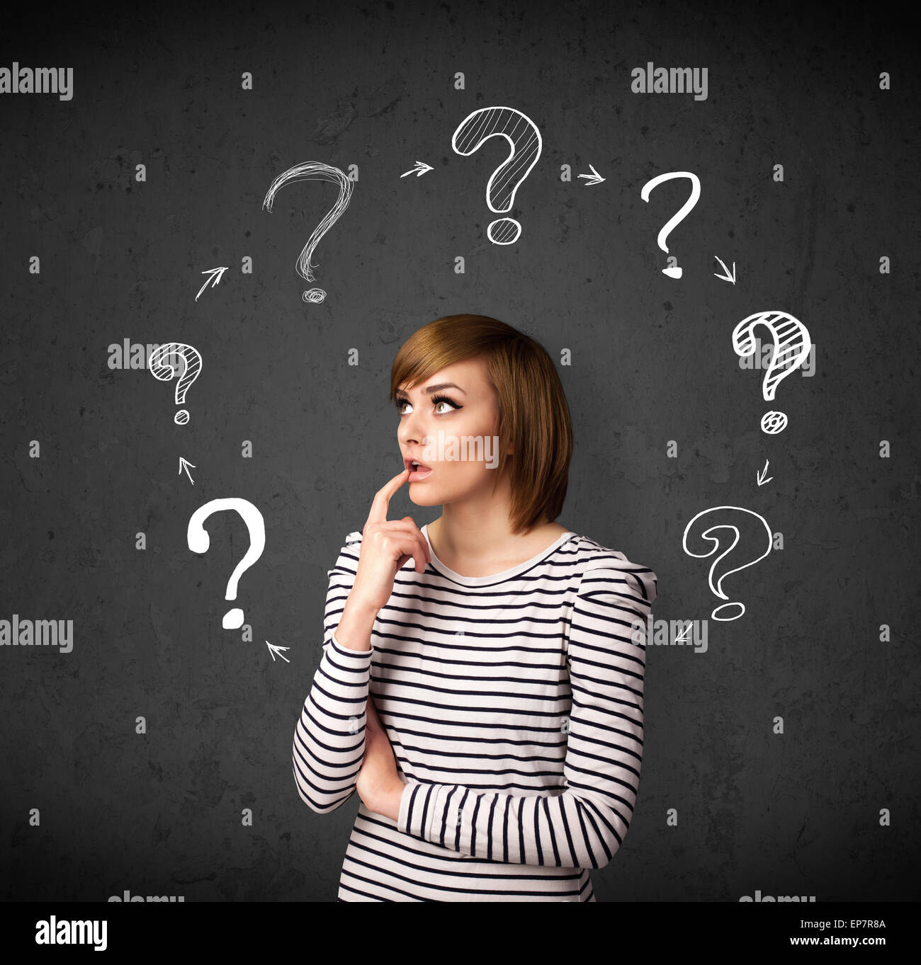 Young woman thinking with question mark circulation around her head ...