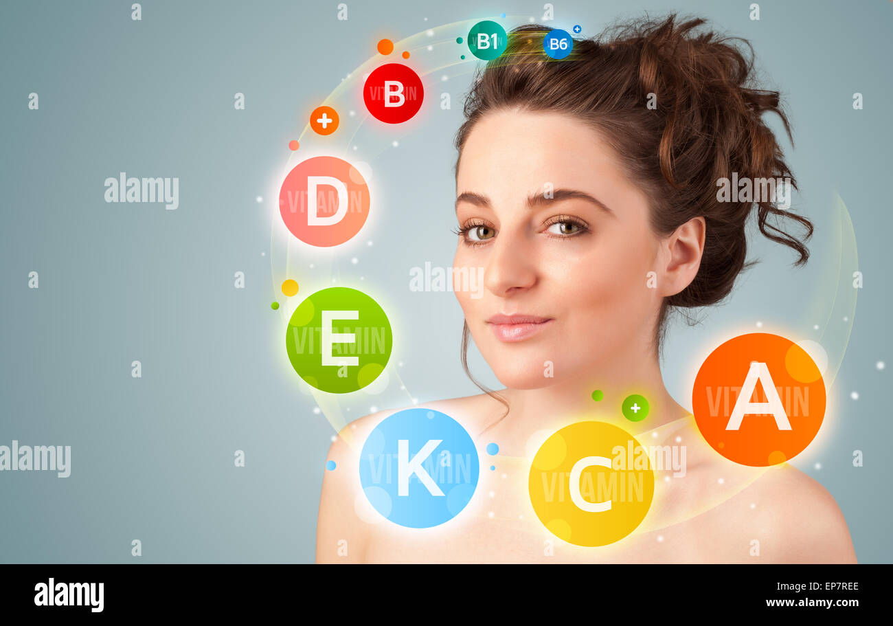 Pretty young girl with colorful vitamin icons and symbols Stock Photo ...