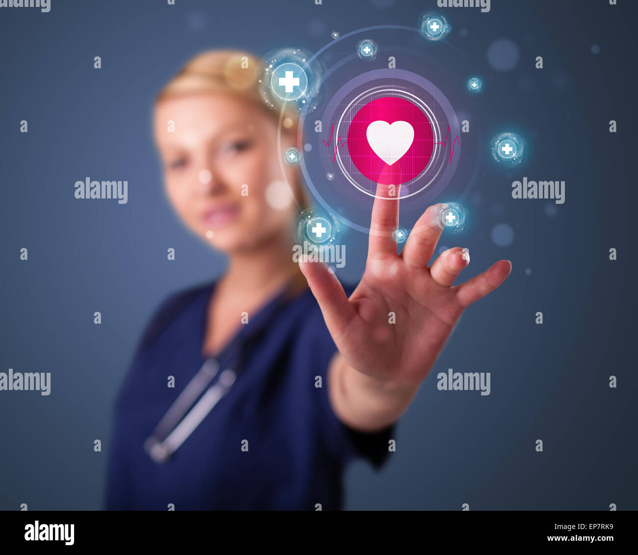 Young nurse pressing modern medical type of buttons Stock Photo - Alamy