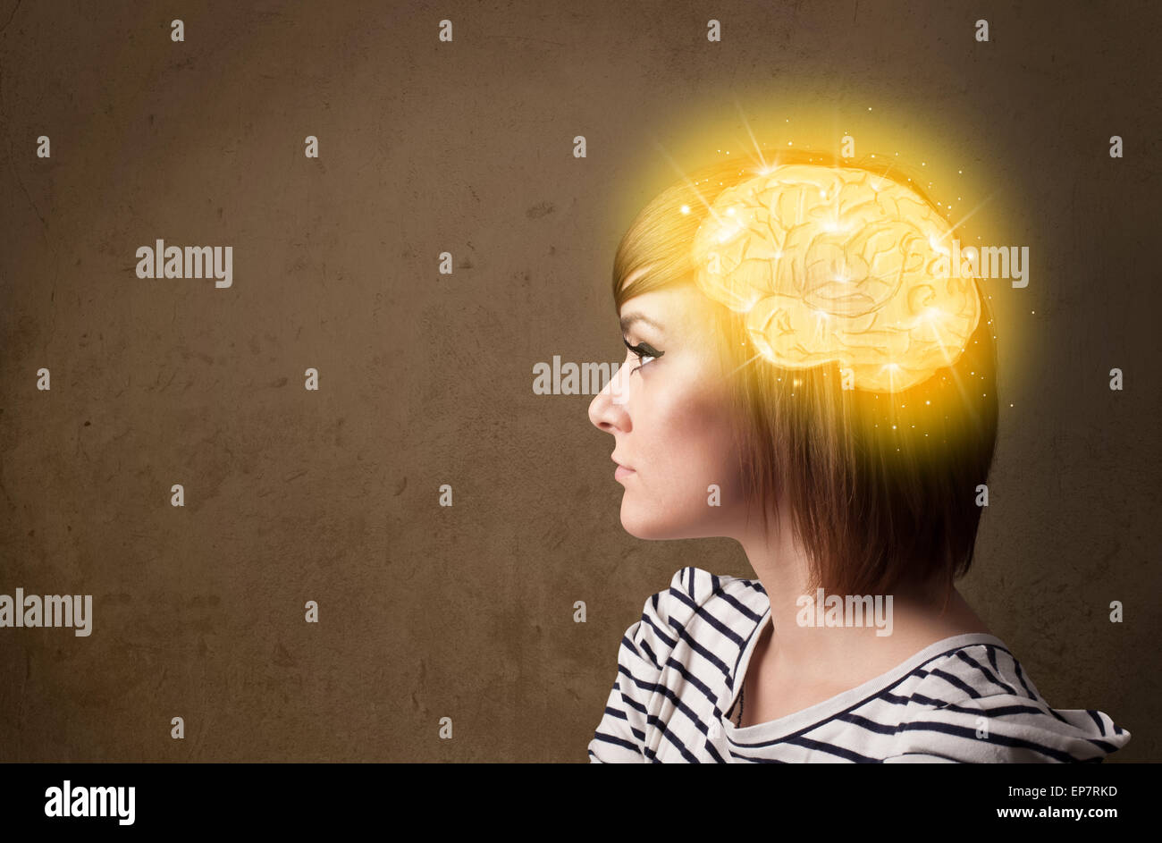 Young girl thinking with glowing brain illustration Stock Photo - Alamy