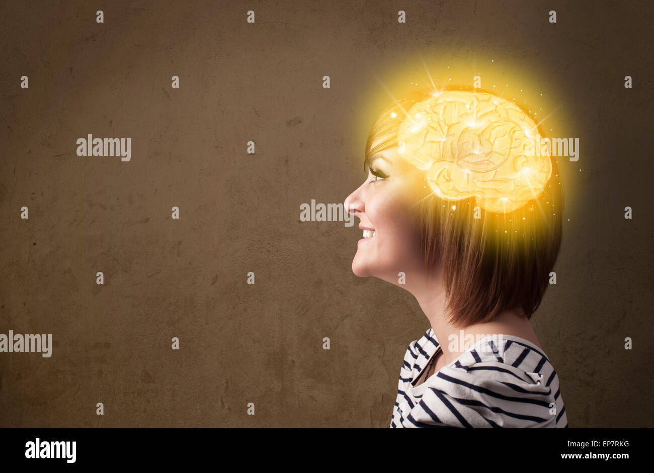 Young girl thinking with glowing brain illustration Stock Photo - Alamy
