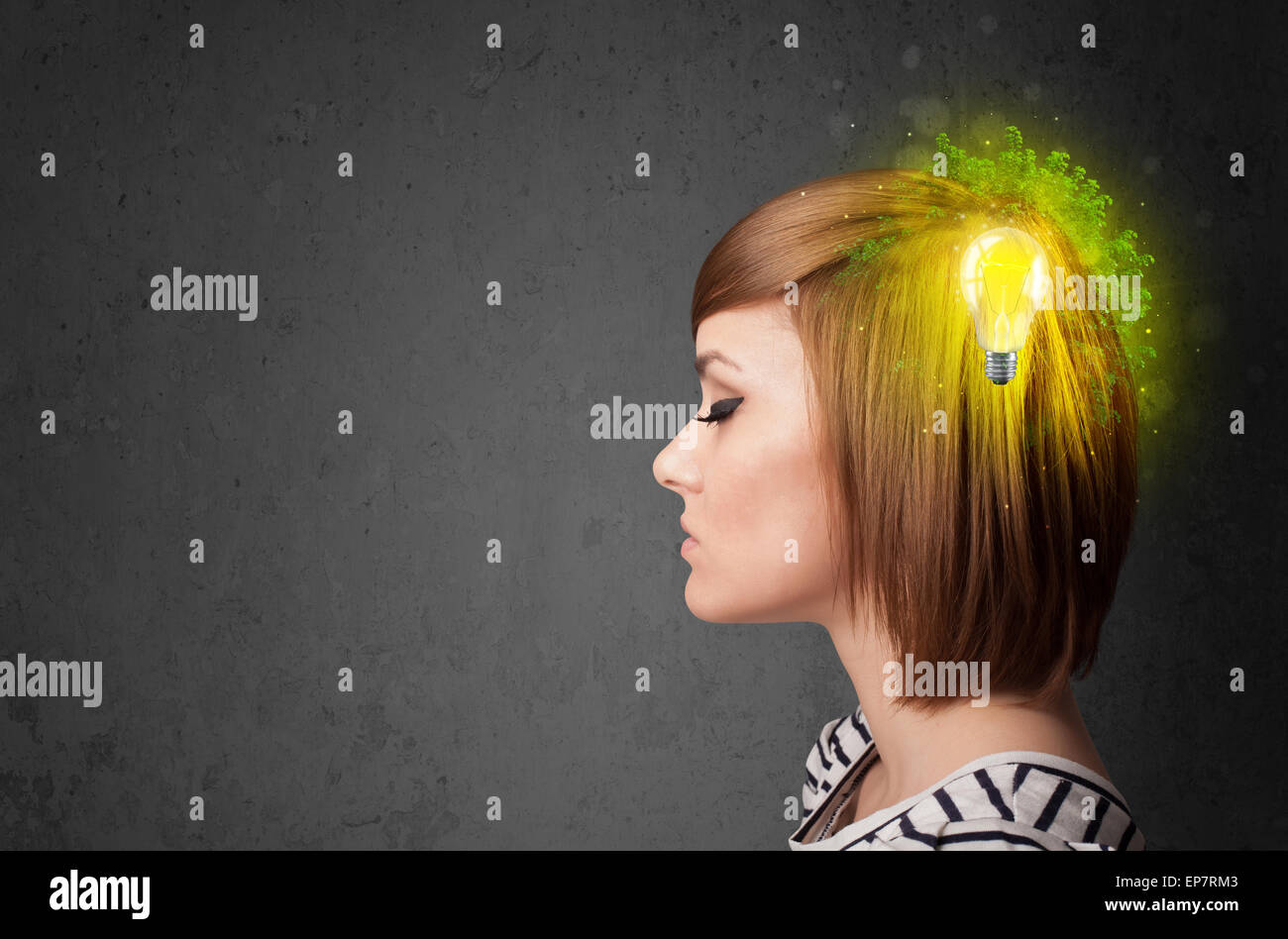 Young mind thinking of green eco energy with lightbulb Stock Photo - Alamy