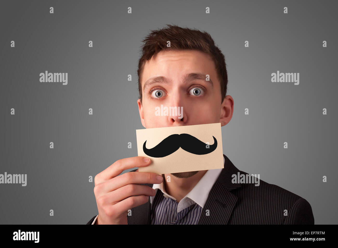 Happy businessman holding funny mustache card on his mouth Stock Photo ...