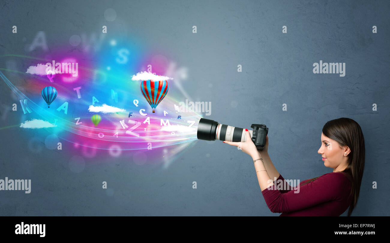 Photographer with camera and abstract imaginary Stock Photo - Alamy